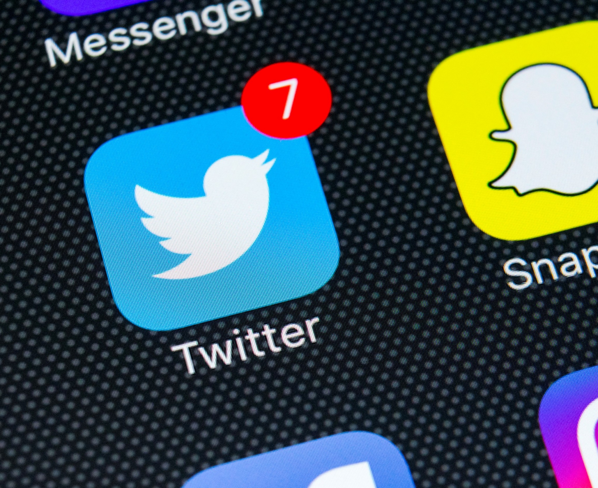 Apple iPhone X on office desk with icons of social media facebook ...